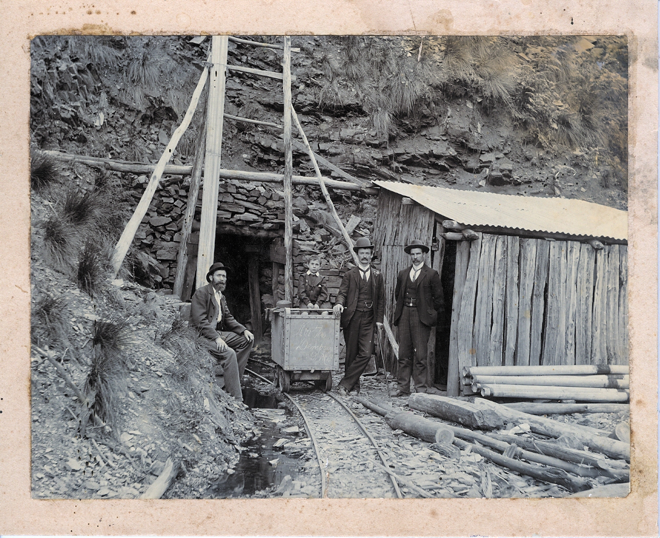 Group of 3 men and 1 boy - at a North Dempsey Mine entrance - High ...