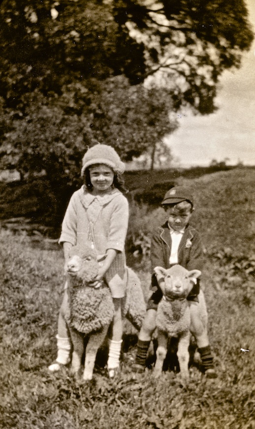 Rene (later Nolan) and her brother, Jim Comerford sitting on their pet ...