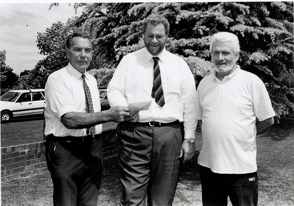 Gordon McMillan presents a cheque to Greg Wilder, Chief Executive ...