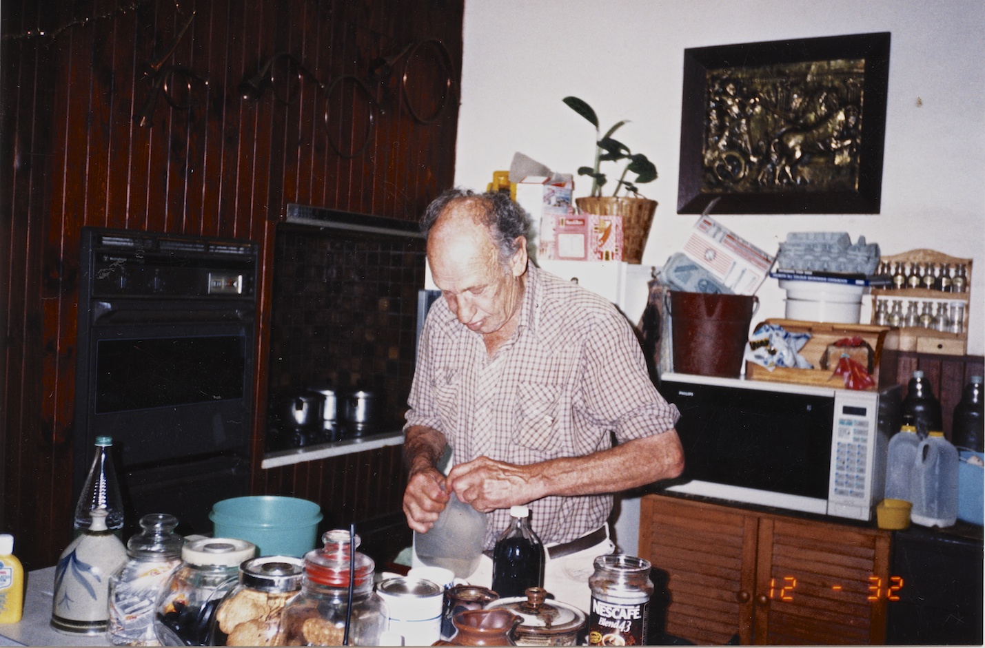 Alan Keith (Jimmy) James, preparing in his kitchen, December 1991 ...