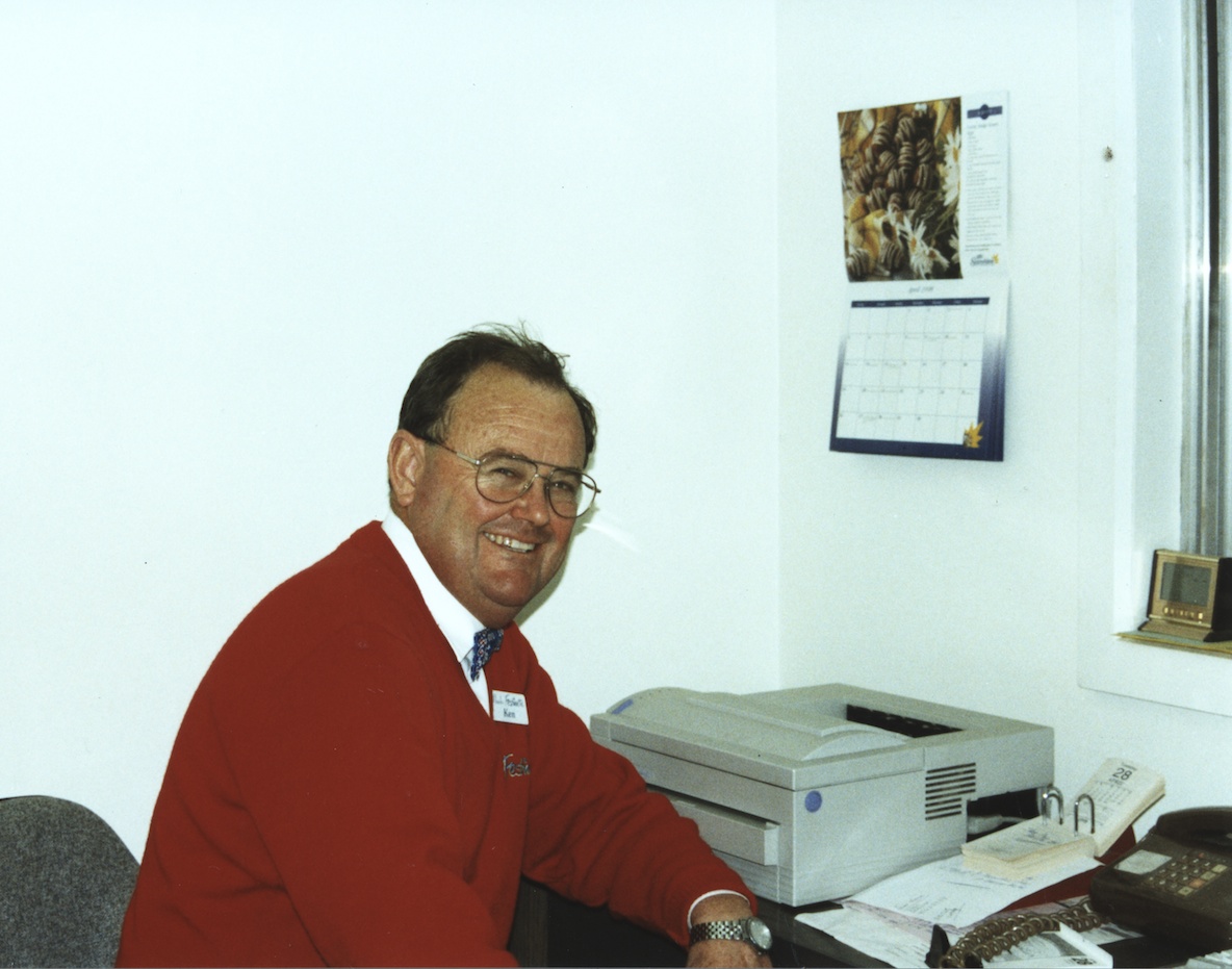 Ken Marks in his Mitre 10 office 1995 - High Country History Hub